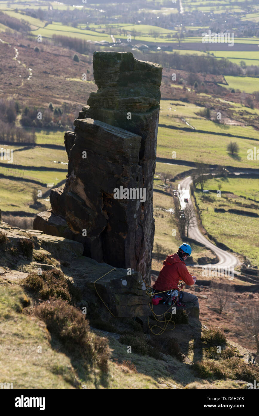 Rock climber on Curbar Edge in the Peak District National Park ...