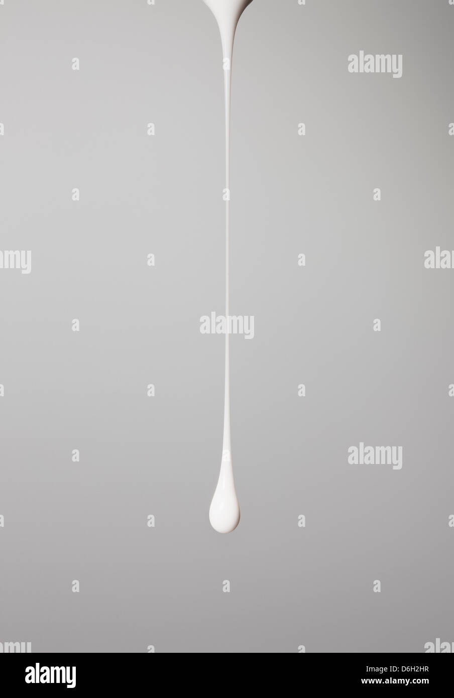 Drop of white paint Stock Photo - Alamy