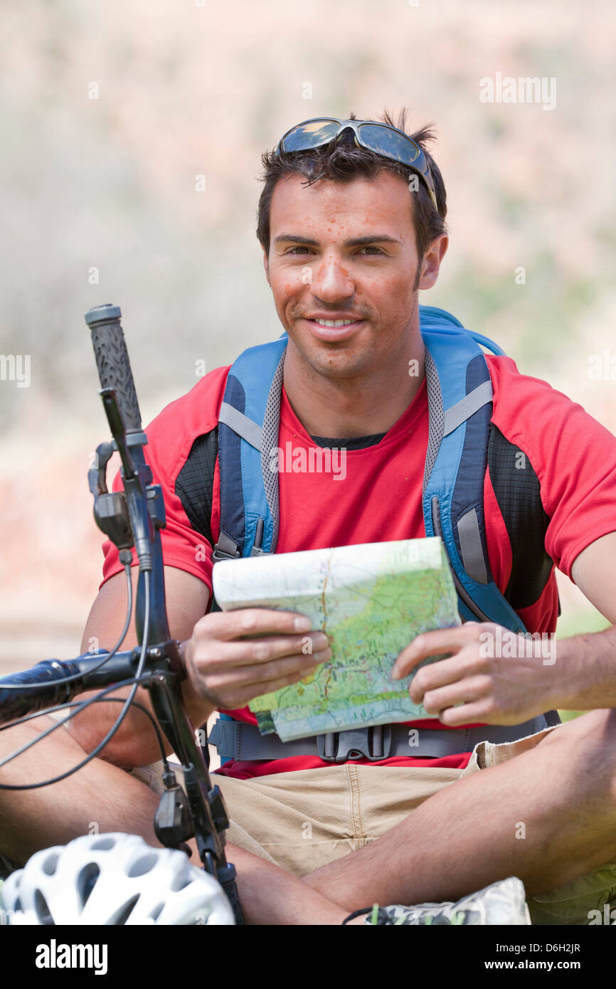 White man sitting while reading map hi-res stock photography and images ...