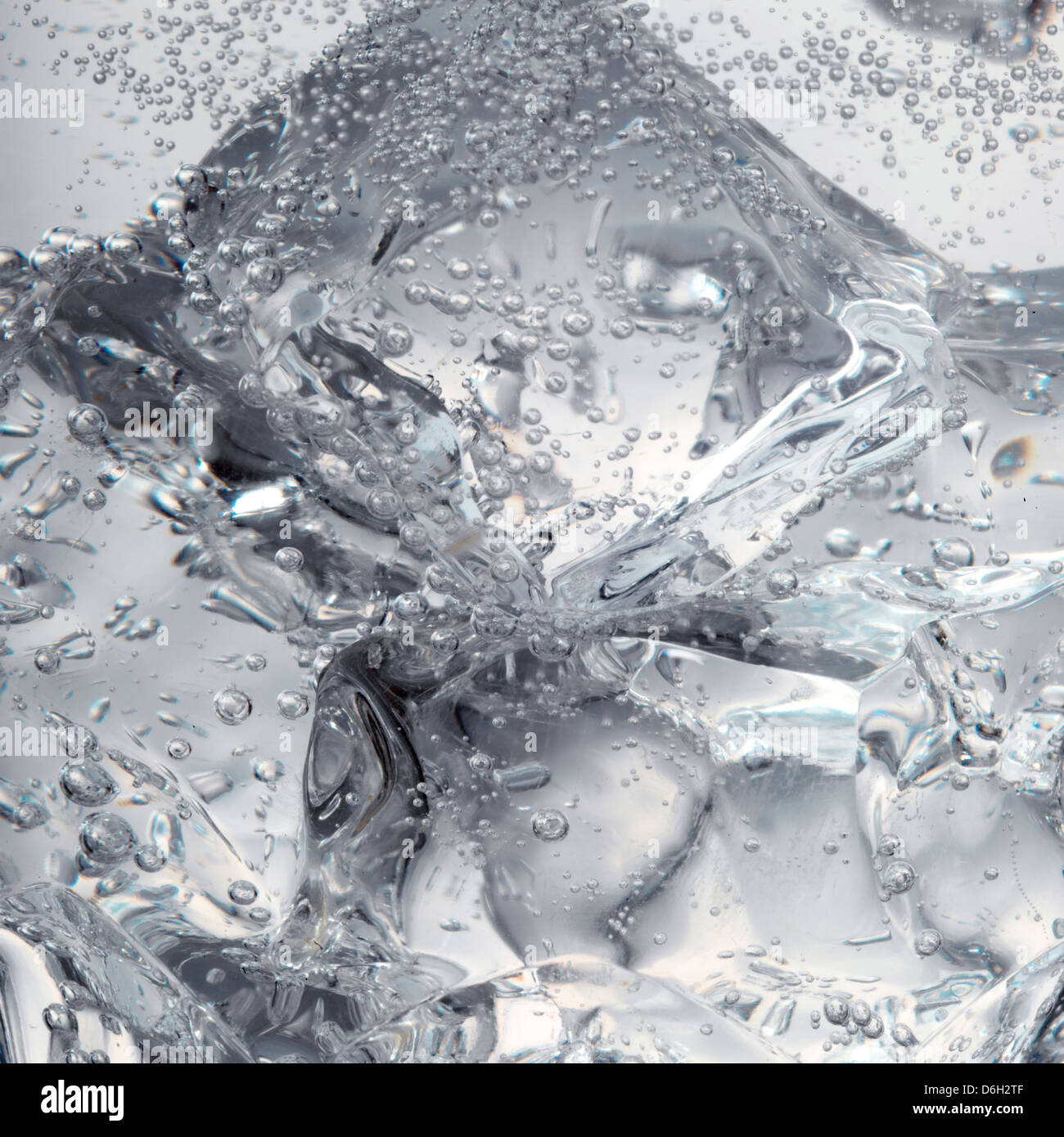 Ice in fizzy drink Stock Photo - Alamy