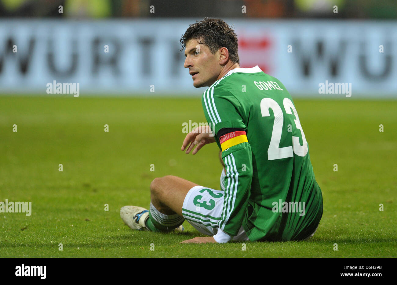 Germany's Mario Gomez sits on the ground during the international ...