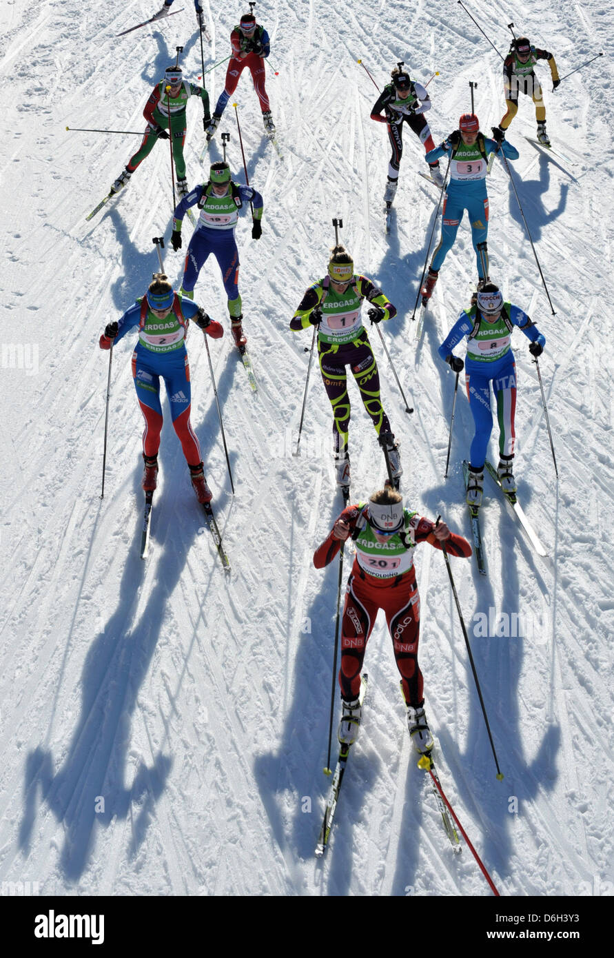 The female biathletes start in the mixed relay event of the Biathlon ...