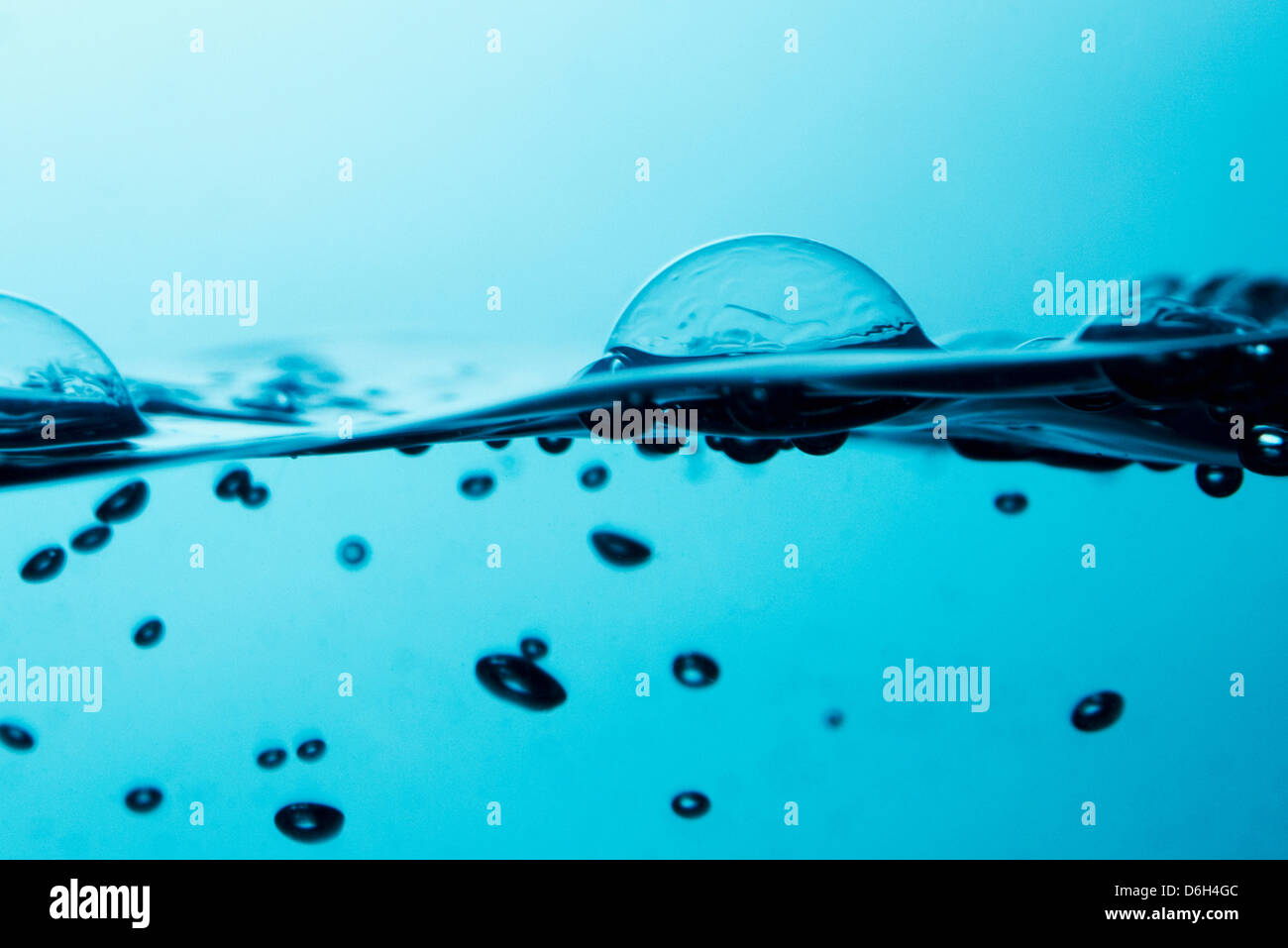Bubbles floating on water Stock Photo - Alamy