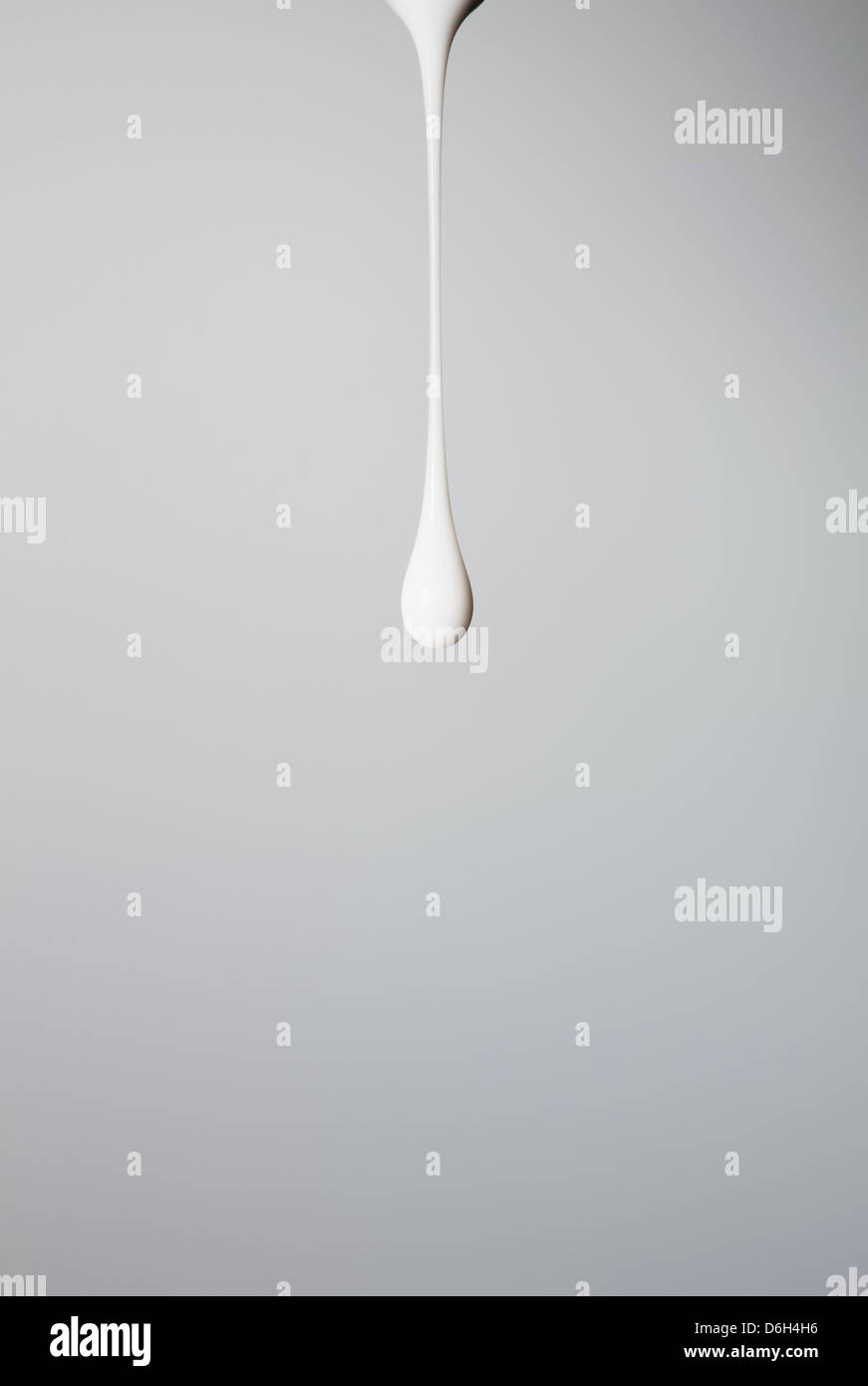 Drop of white paint Stock Photo - Alamy