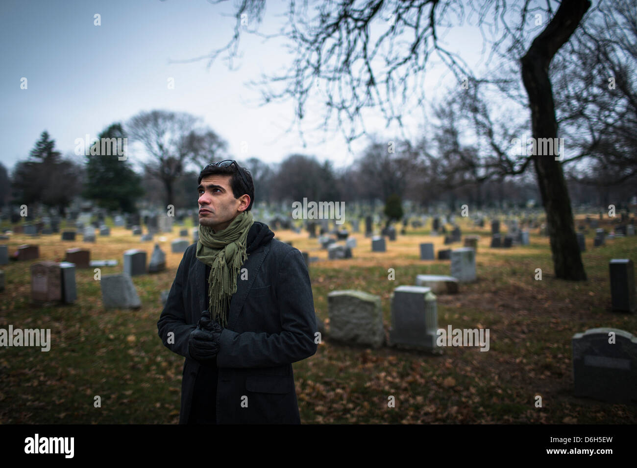 Man visiting graveyard Stock Photo - Alamy