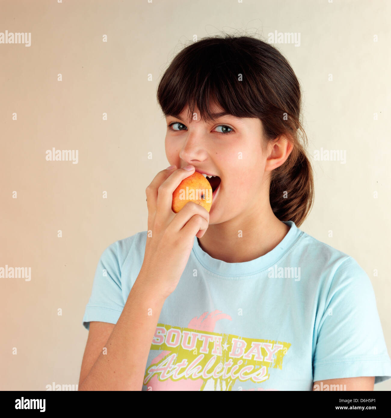 Child eating pear Stock Photo - Alamy