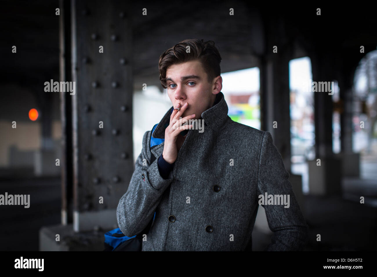 Man smoking cigarette outdoors Stock Photo - Alamy