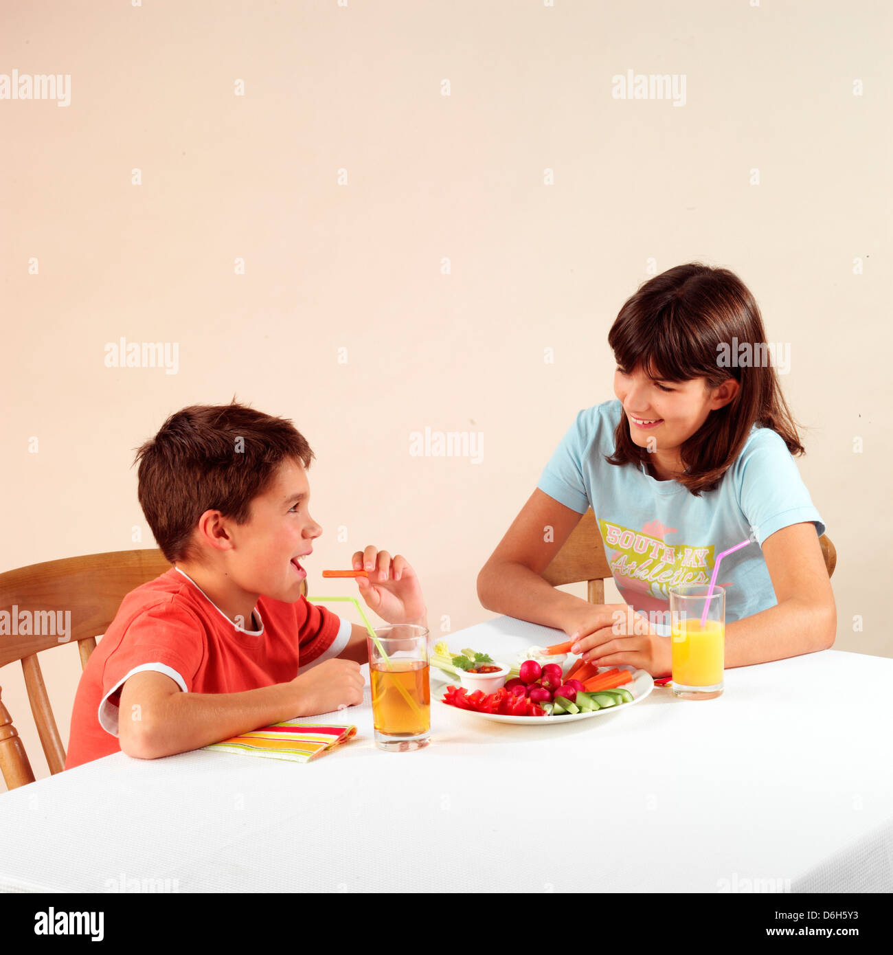 Children eating and drinking Stock Photo - Alamy