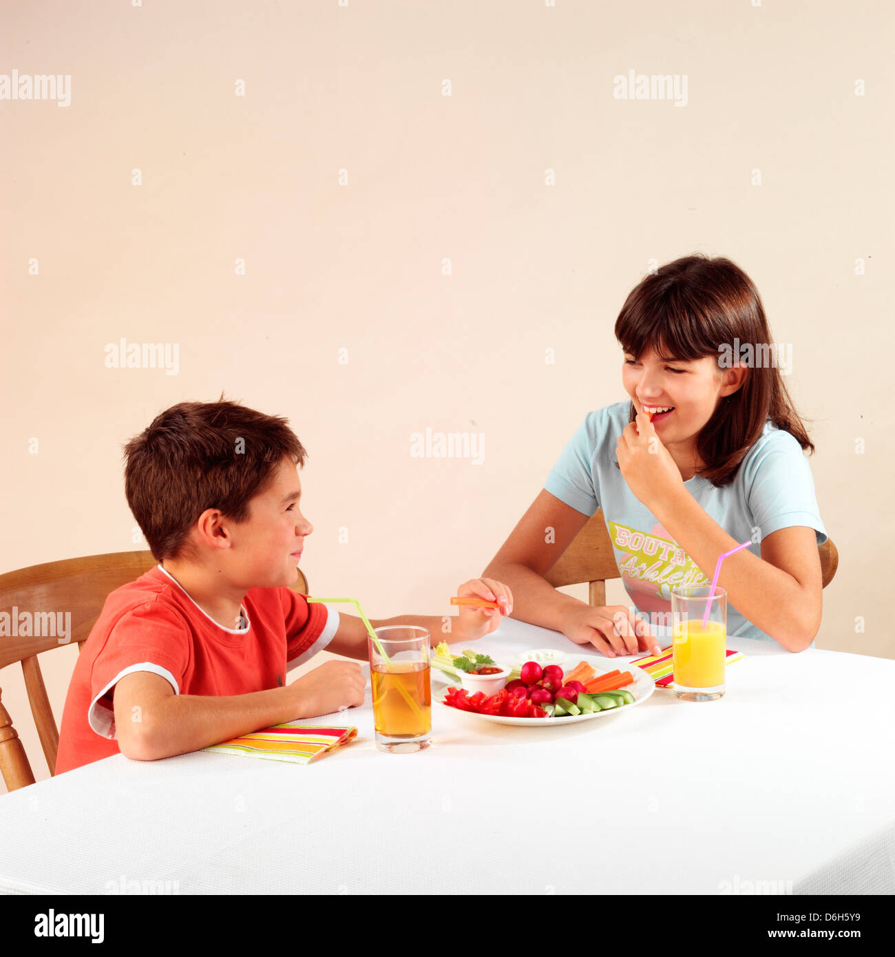 Children eating and drinking Stock Photo - Alamy
