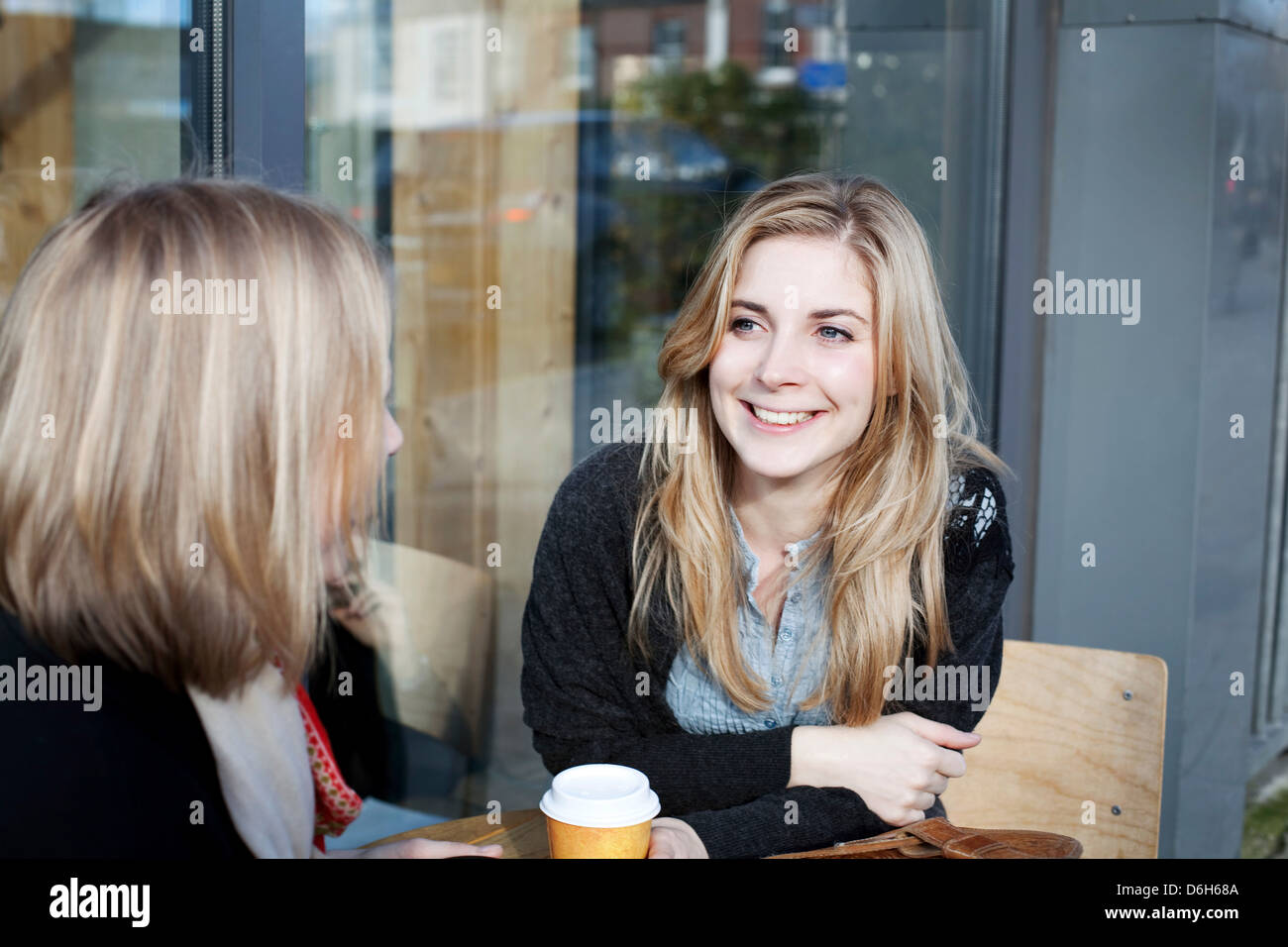 Women having coffee together outdoors Stock Photo - Alamy