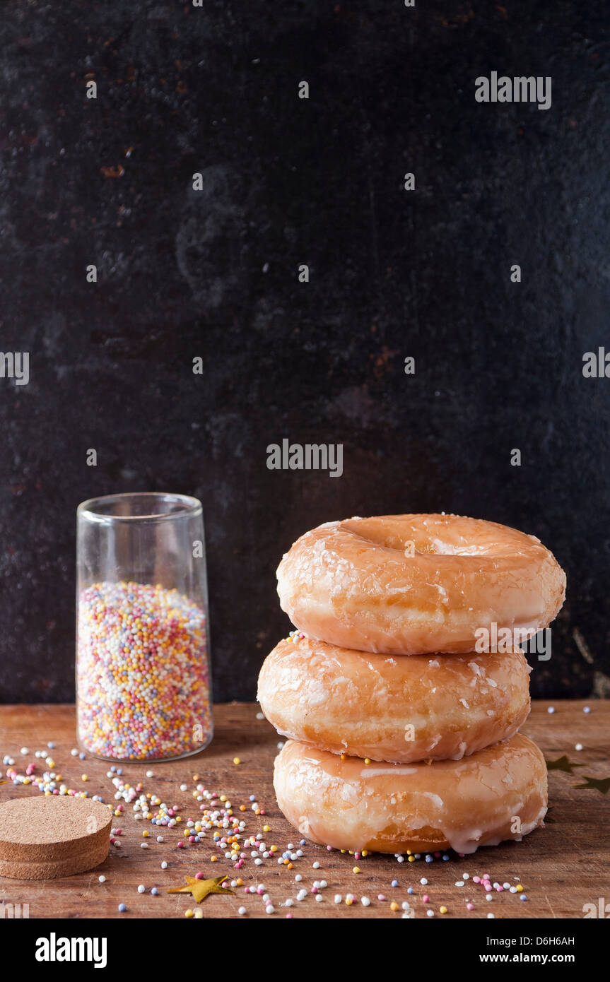 Stack of glazed donuts and sprinkles Stock Photo - Alamy