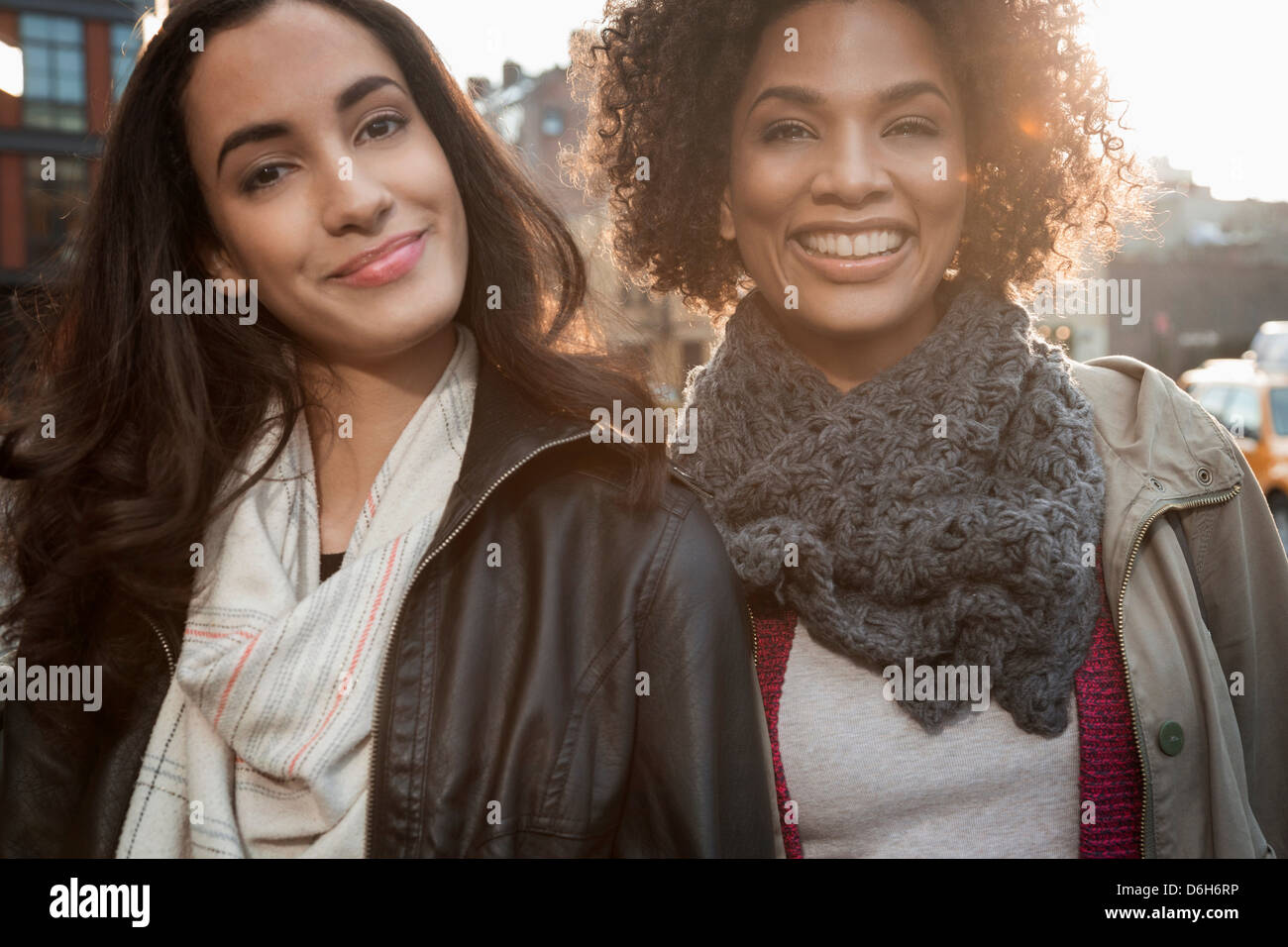 Smiling women on city street Stock Photo - Alamy