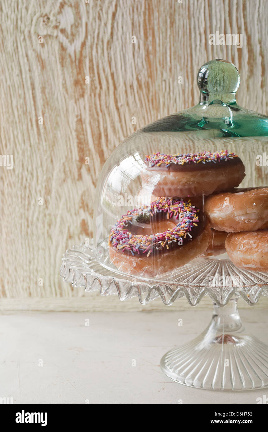 Doughnuts under glass jar Stock Photo - Alamy