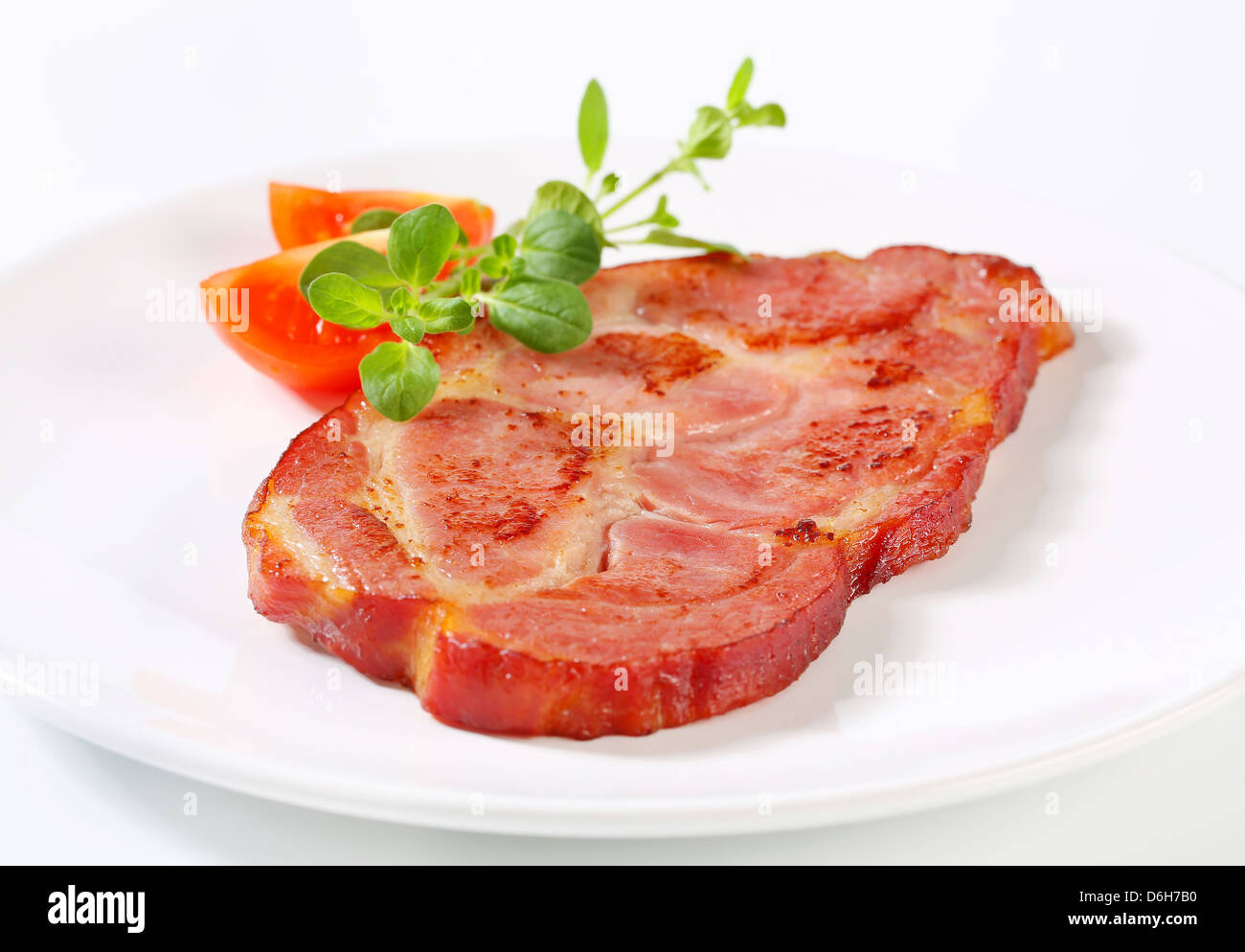Slice of smoked pork neck Stock Photo - Alamy