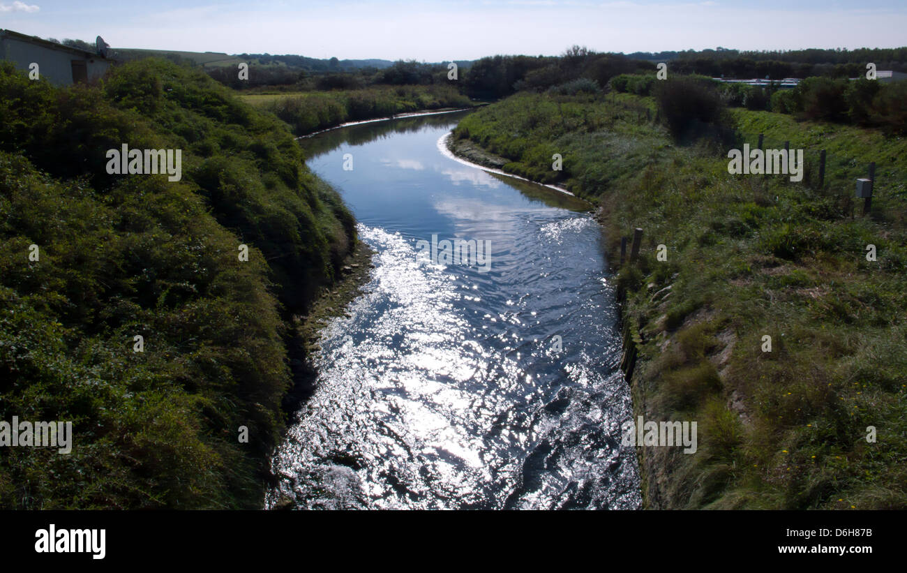 River running through fields and sunlight, Normandy, France Stock Photo ...