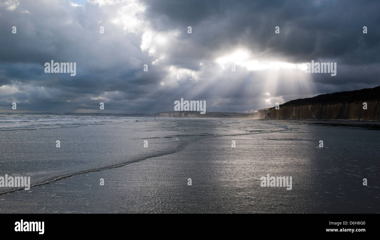 Sun rays over cliffs sea and beach, Normandy, France Stock Photo - Alamy