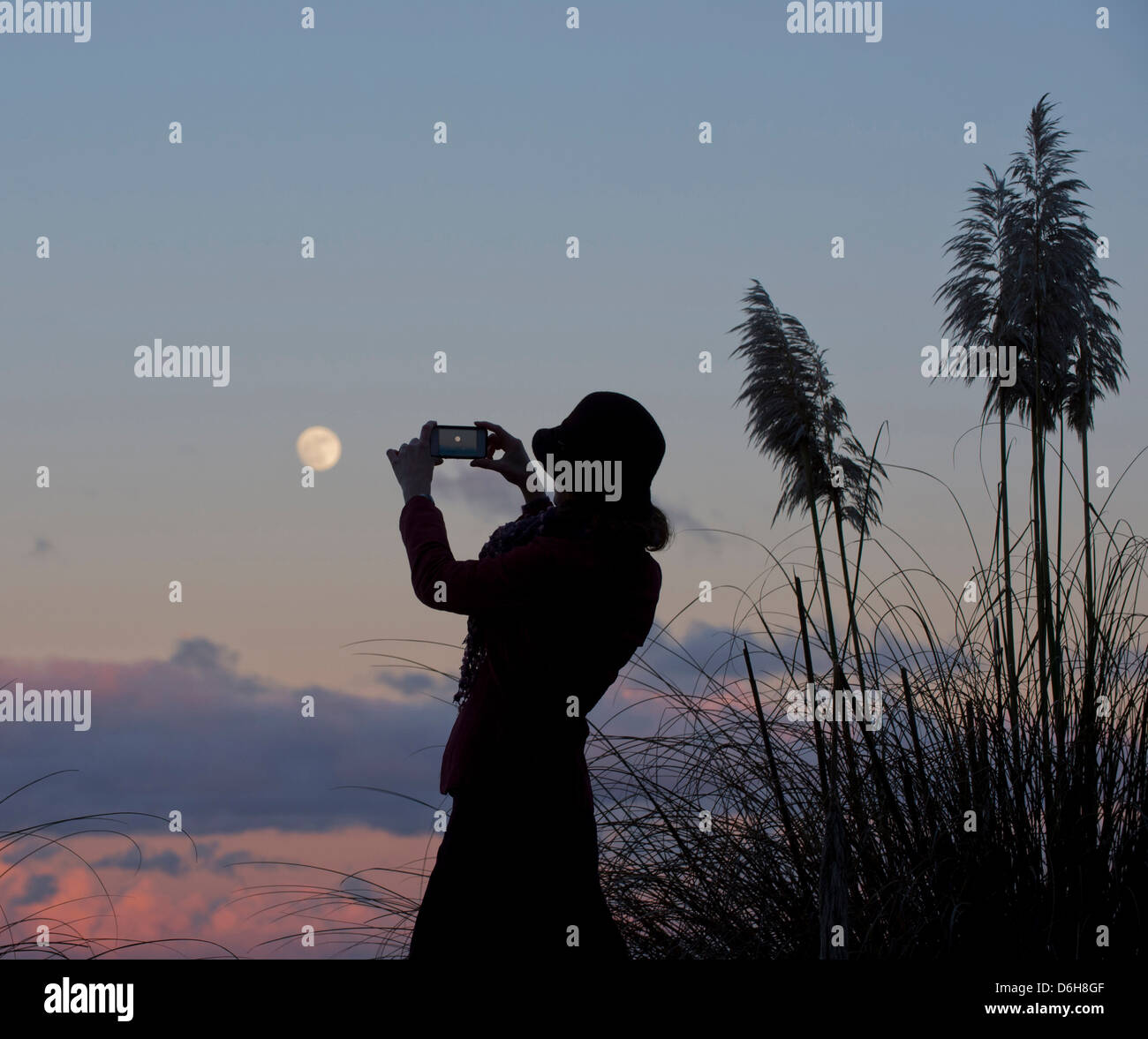 Woman taking picture full moon hi-res stock photography and images - Alamy