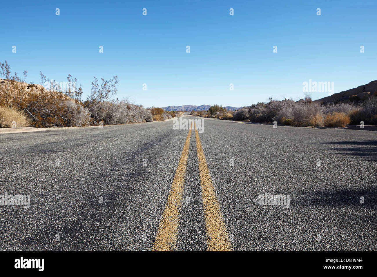 Paved road in rural landscape Stock Photo - Alamy