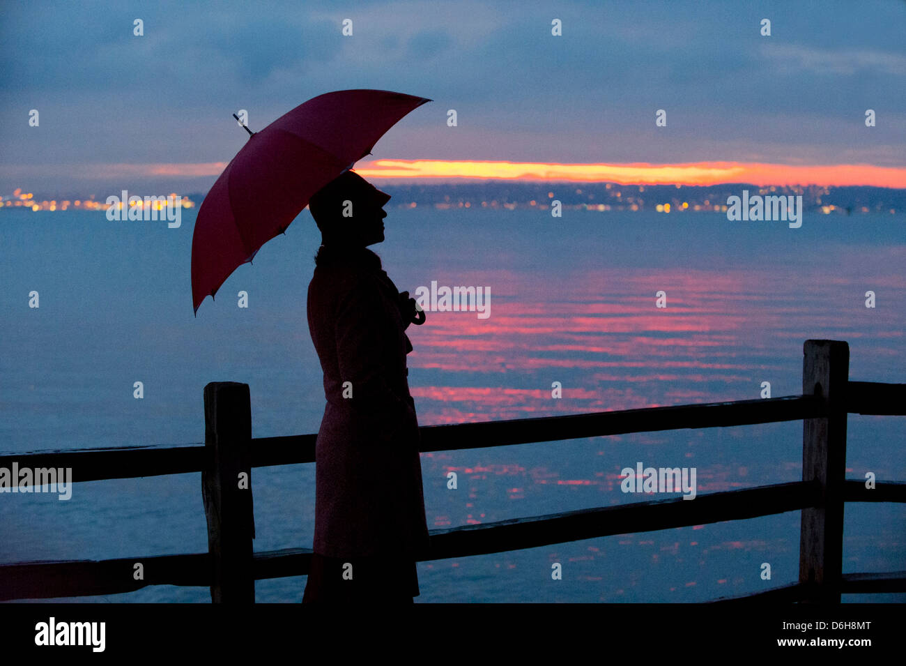 Older woman watching sunset hi-res stock photography and images - Alamy