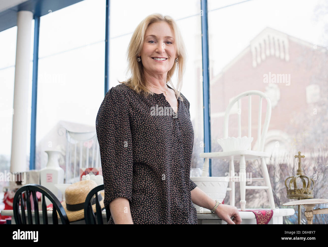 Woman stands smiling in city hi-res stock photography and images - Alamy