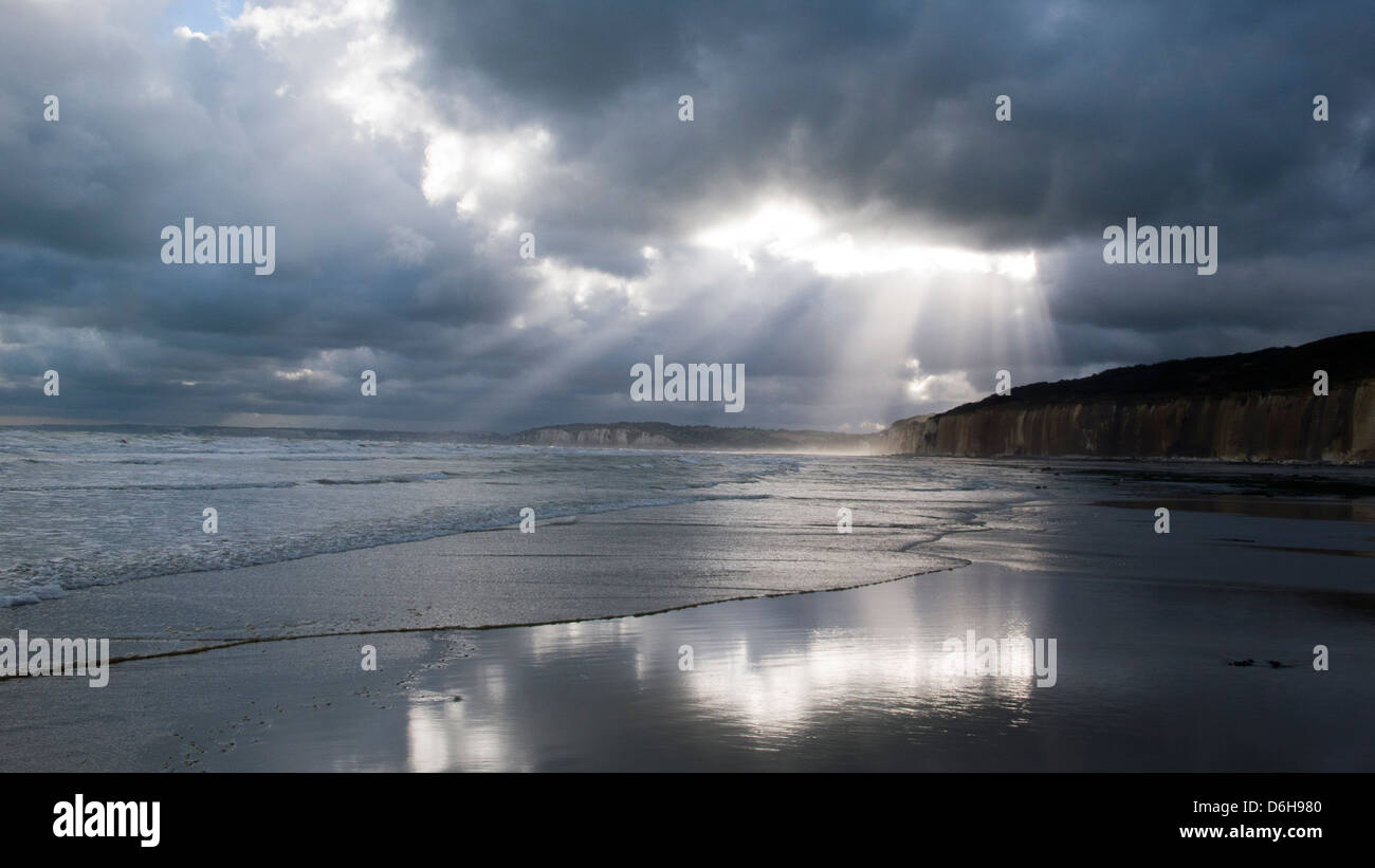Sun rays over cliffs sea and beach, Normandy, France Stock Photo - Alamy