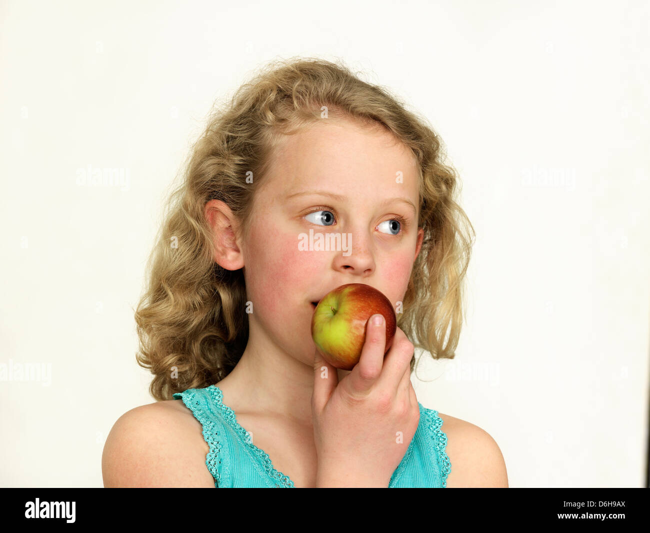 Young girl eating apple Model release all media Stock Photo - Alamy