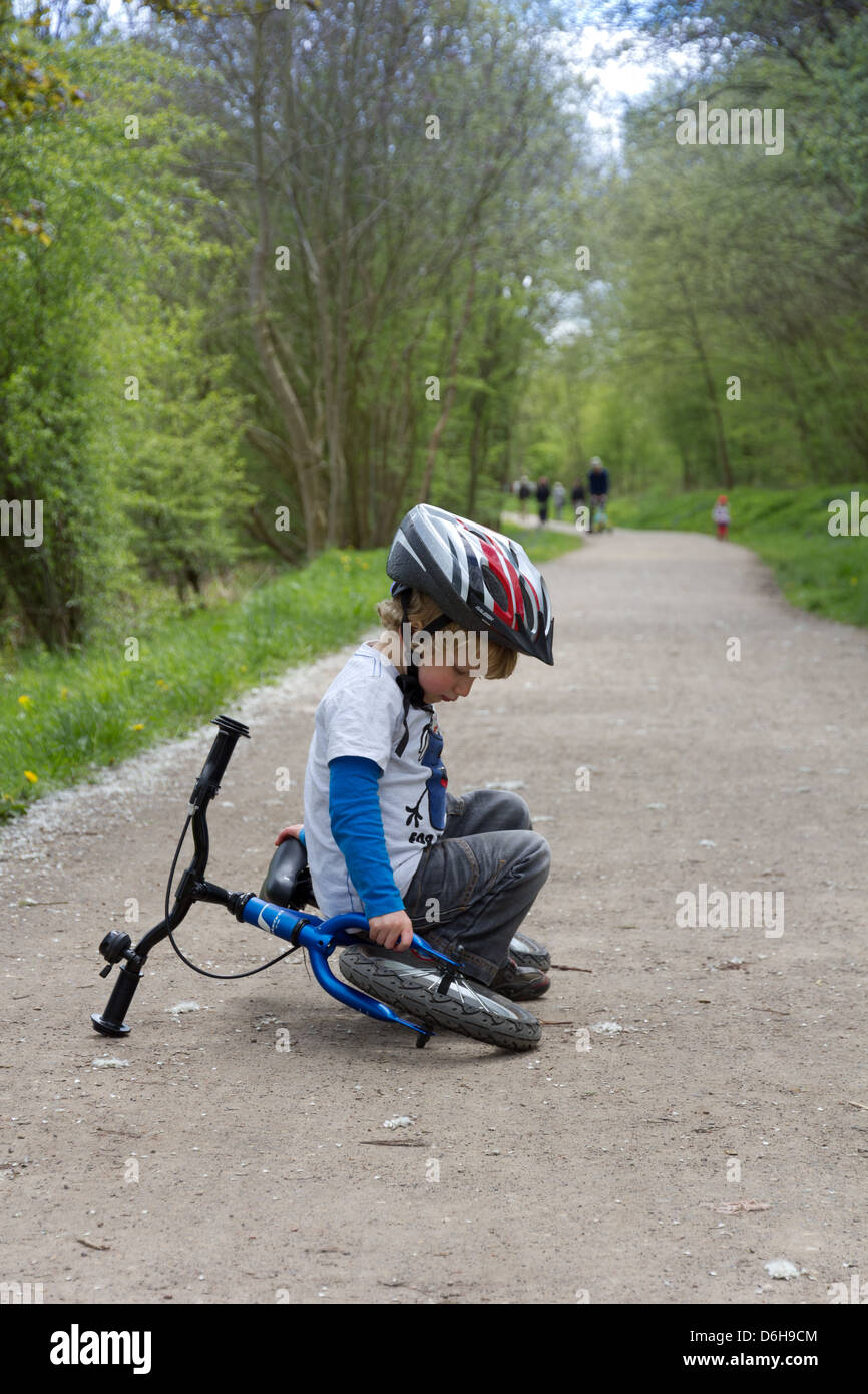 Sad Boy On Bike High Resolution Stock Photography and Images - Alamy