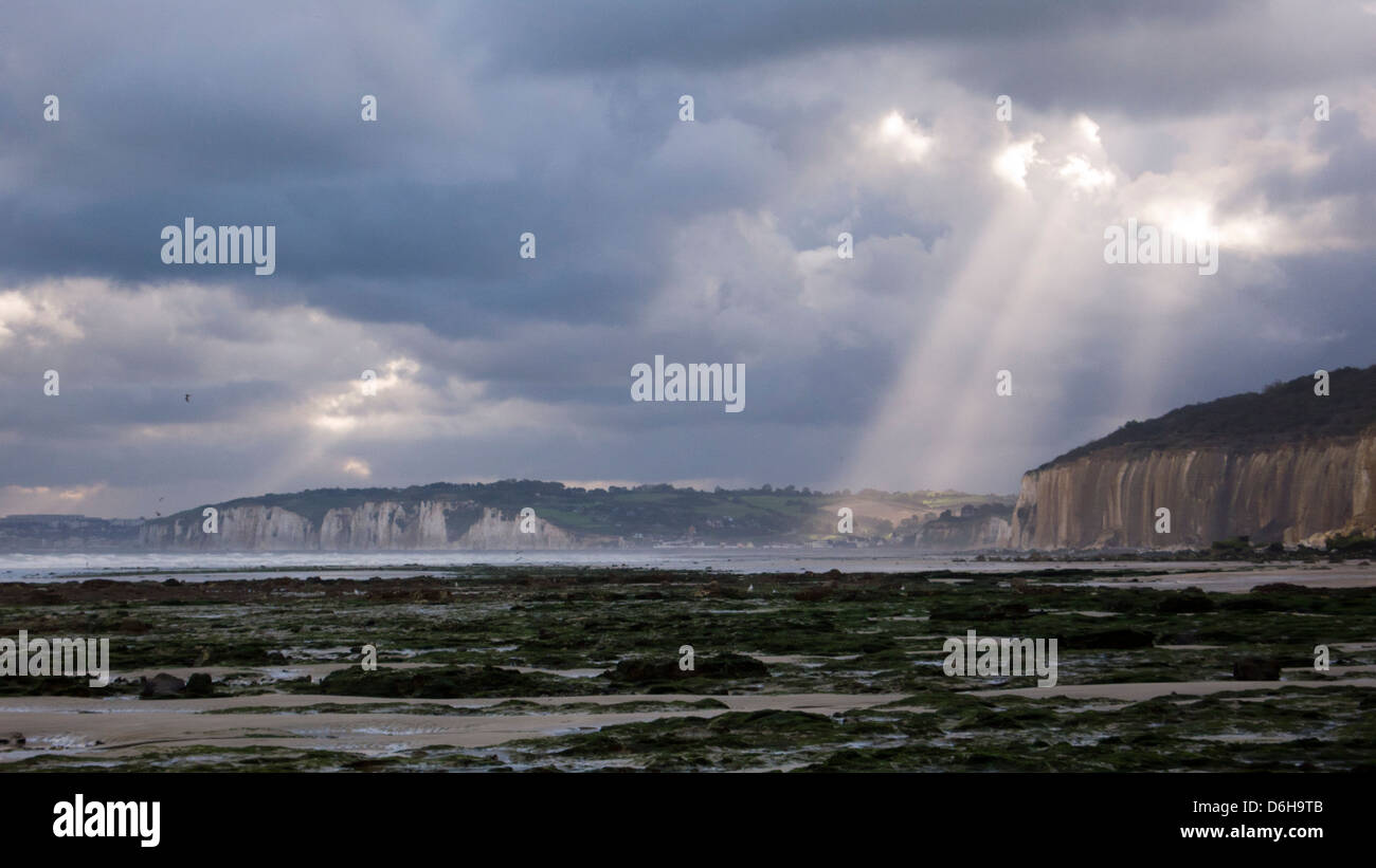 Sun rays over cliffs sea and beach, Normandy, France Stock Photo - Alamy