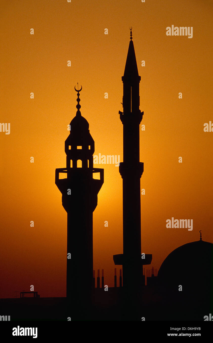 jeddah, saudi arabia -- sunset with minarets of a mosque in the ...