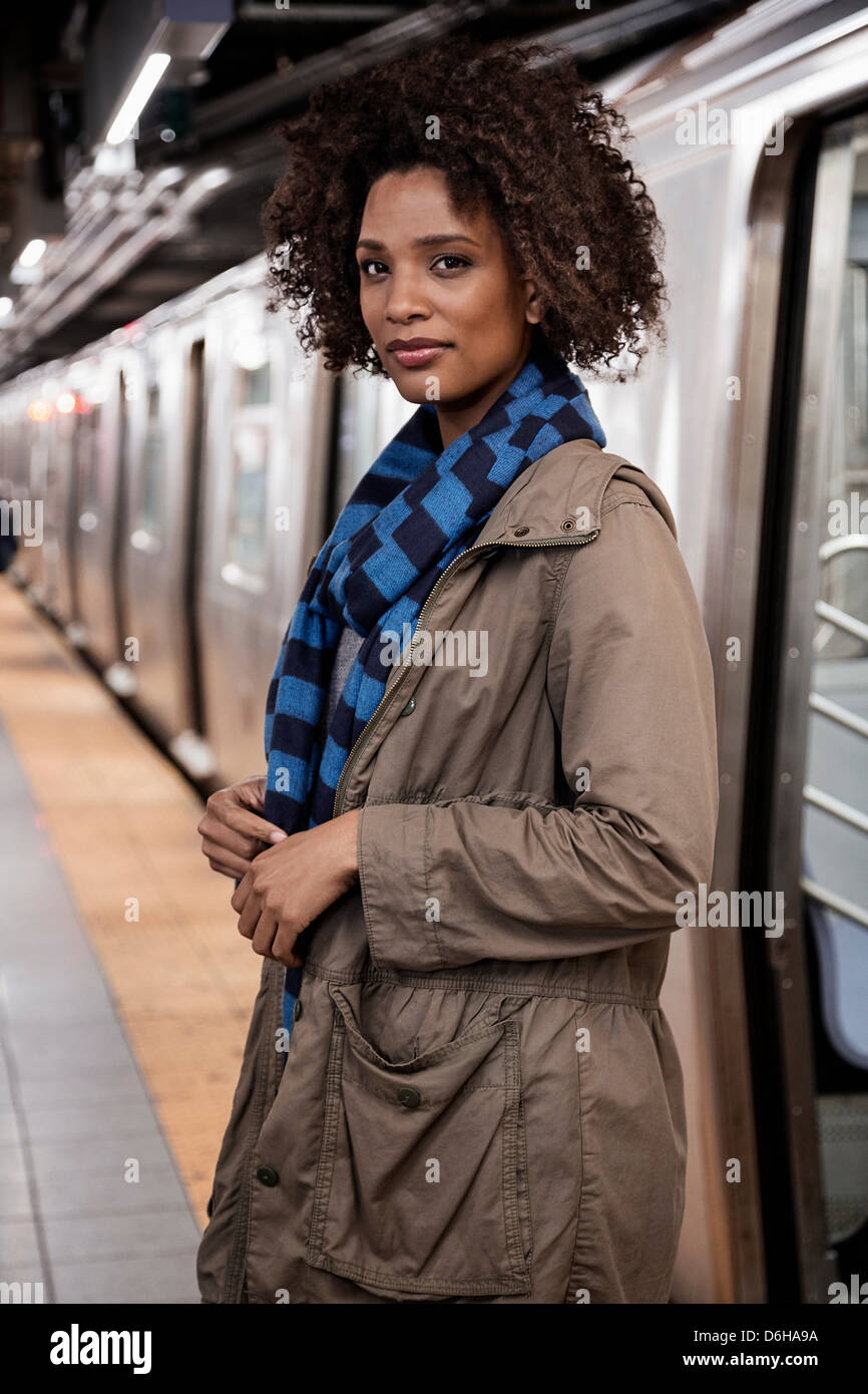 Woman walking on subway platform Stock Photo - Alamy