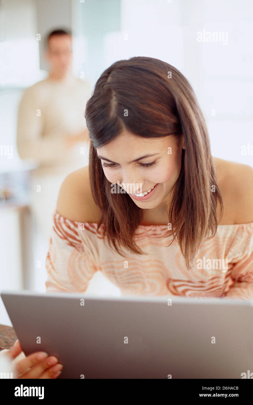 Woman using a laptop Stock Photo - Alamy