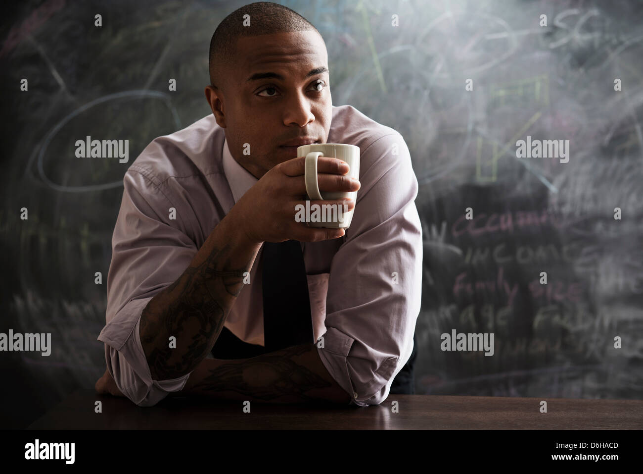 Man drinking cup of coffee Stock Photo - Alamy