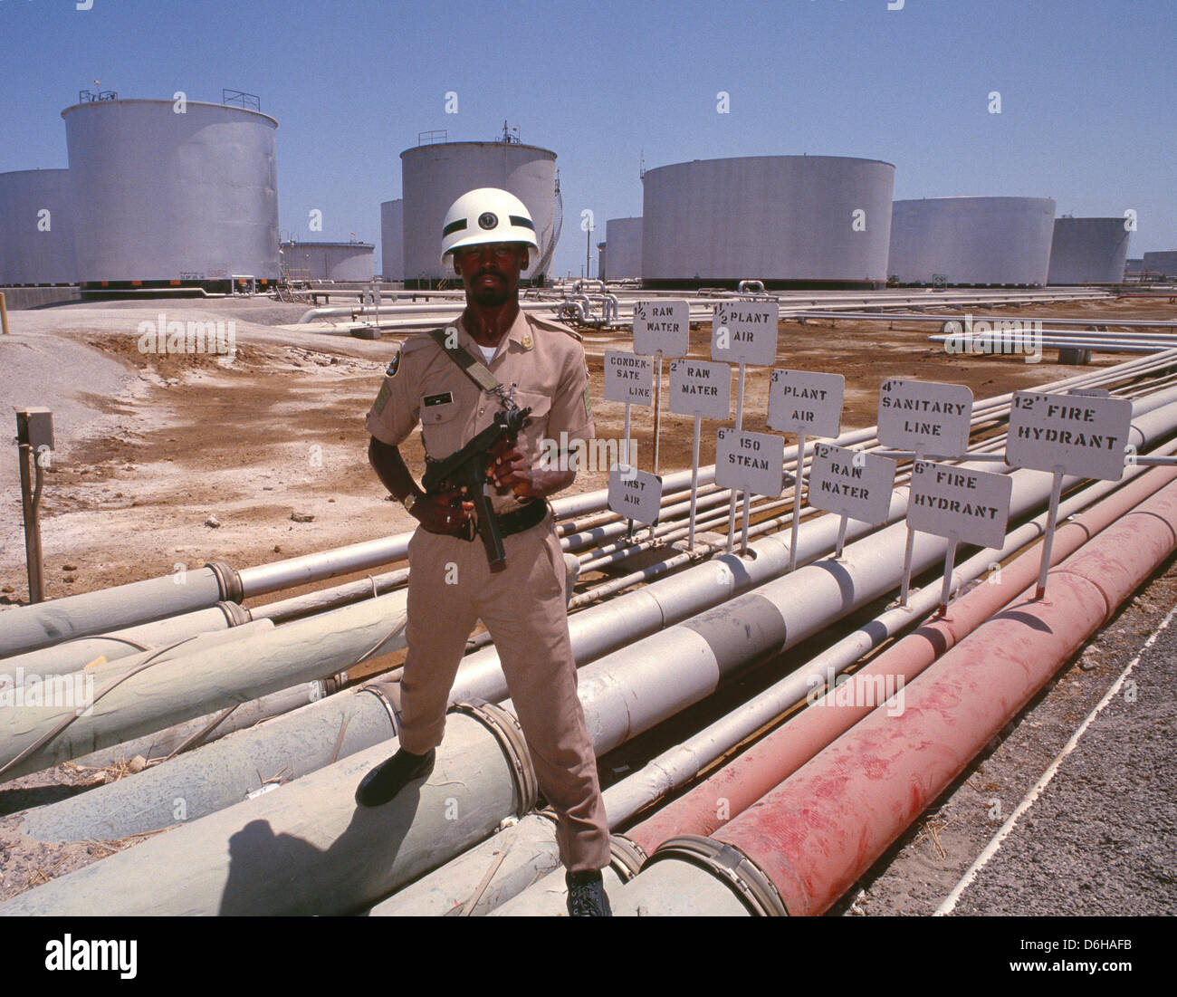 A Saudi soldier on duty at the largest oil refinery in the world ...