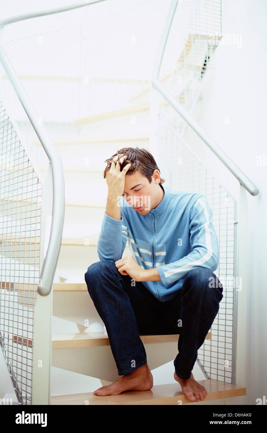 Young man looking depressed Stock Photo - Alamy