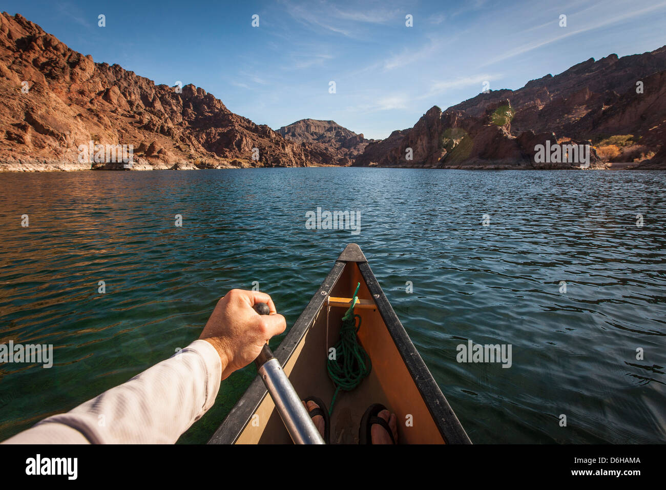 Man rowing canoe on still rural lake Stock Photo - Alamy