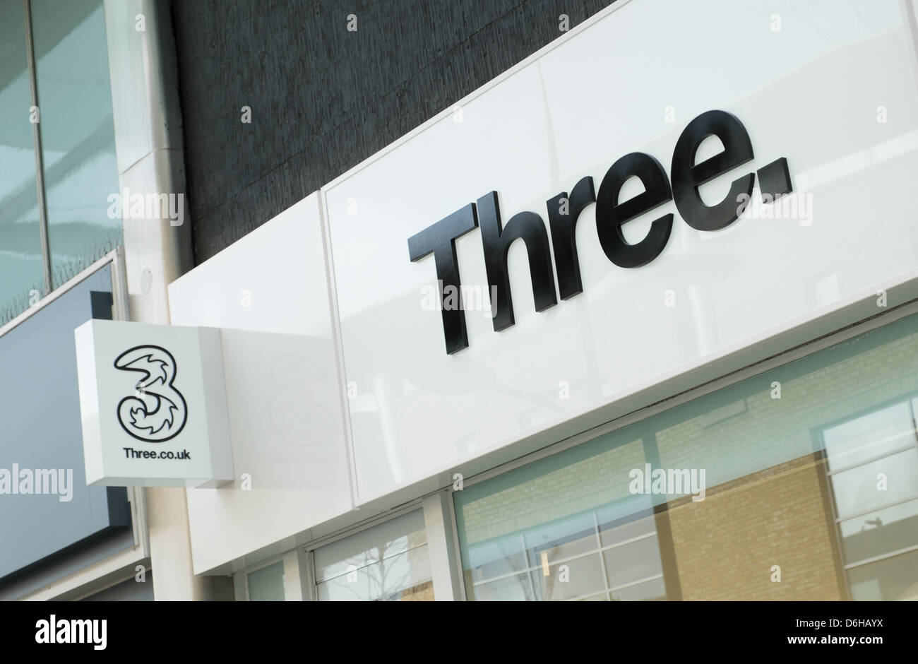 A Three store sign UK, showing updated (2013) branding Stock Photo - Alamy