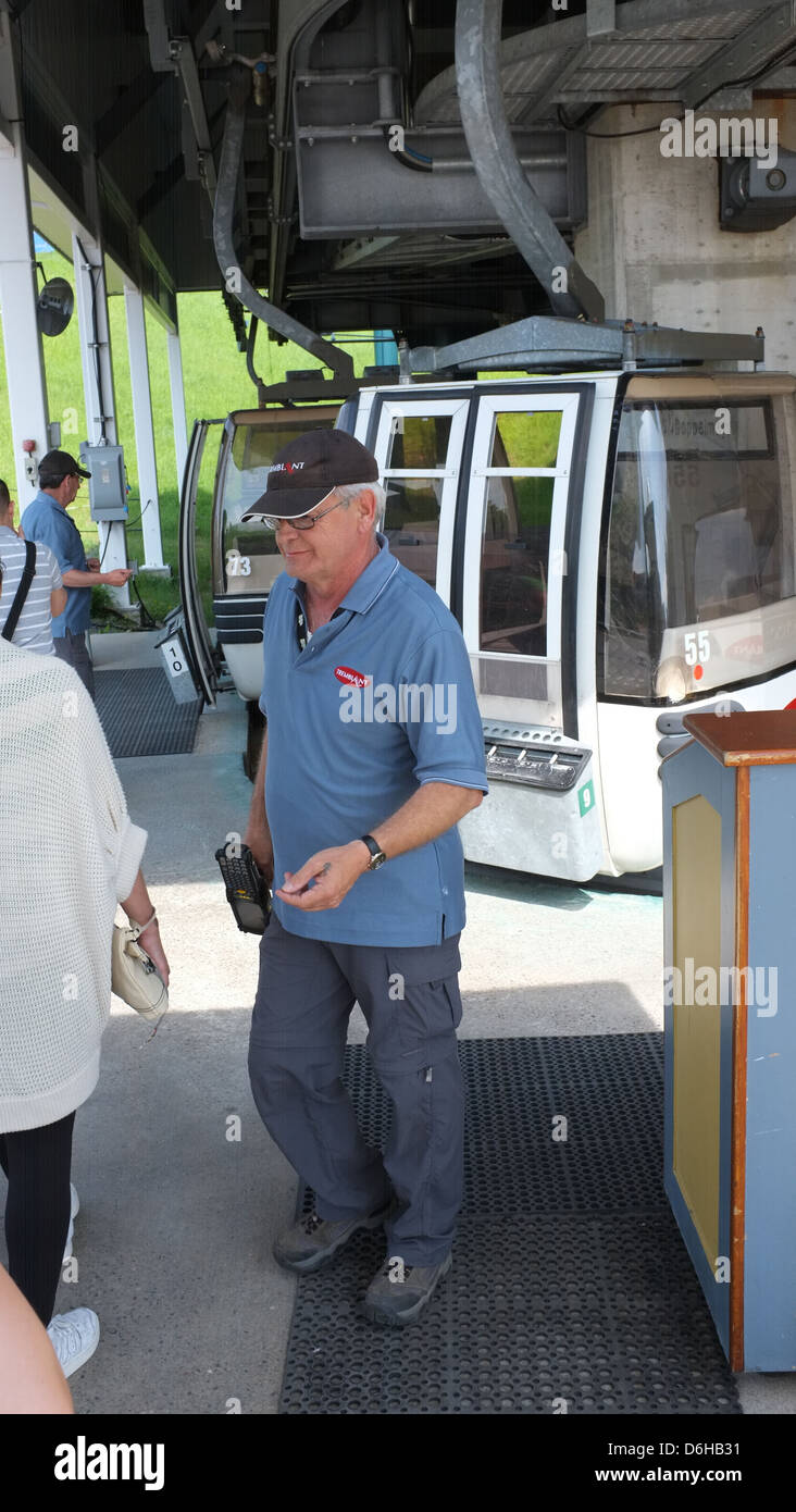 A gondola lift operator checks tickets at the ski resort Mont-Tremblant ...