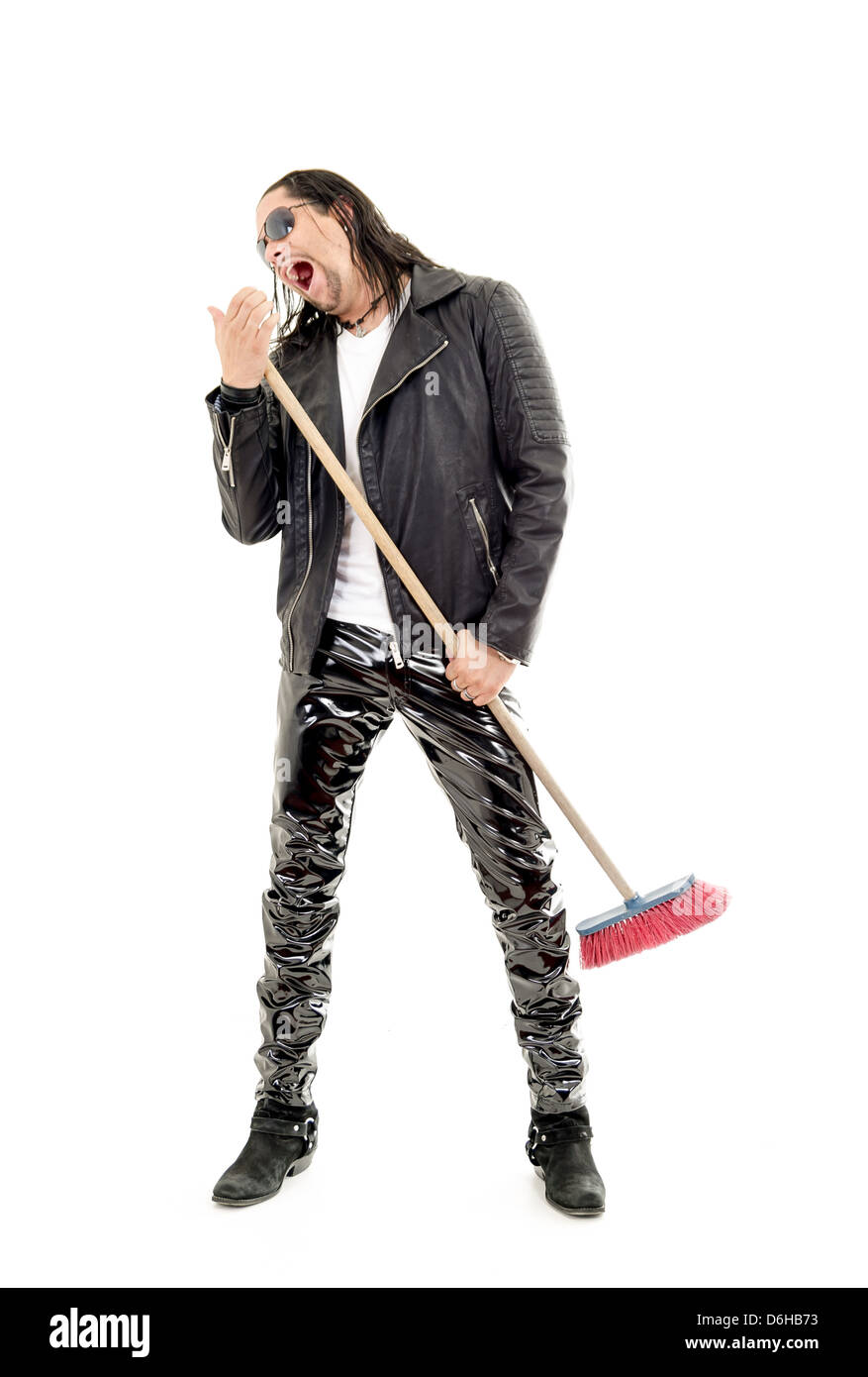 Man Rocking Out with broom Stock Photo - Alamy
