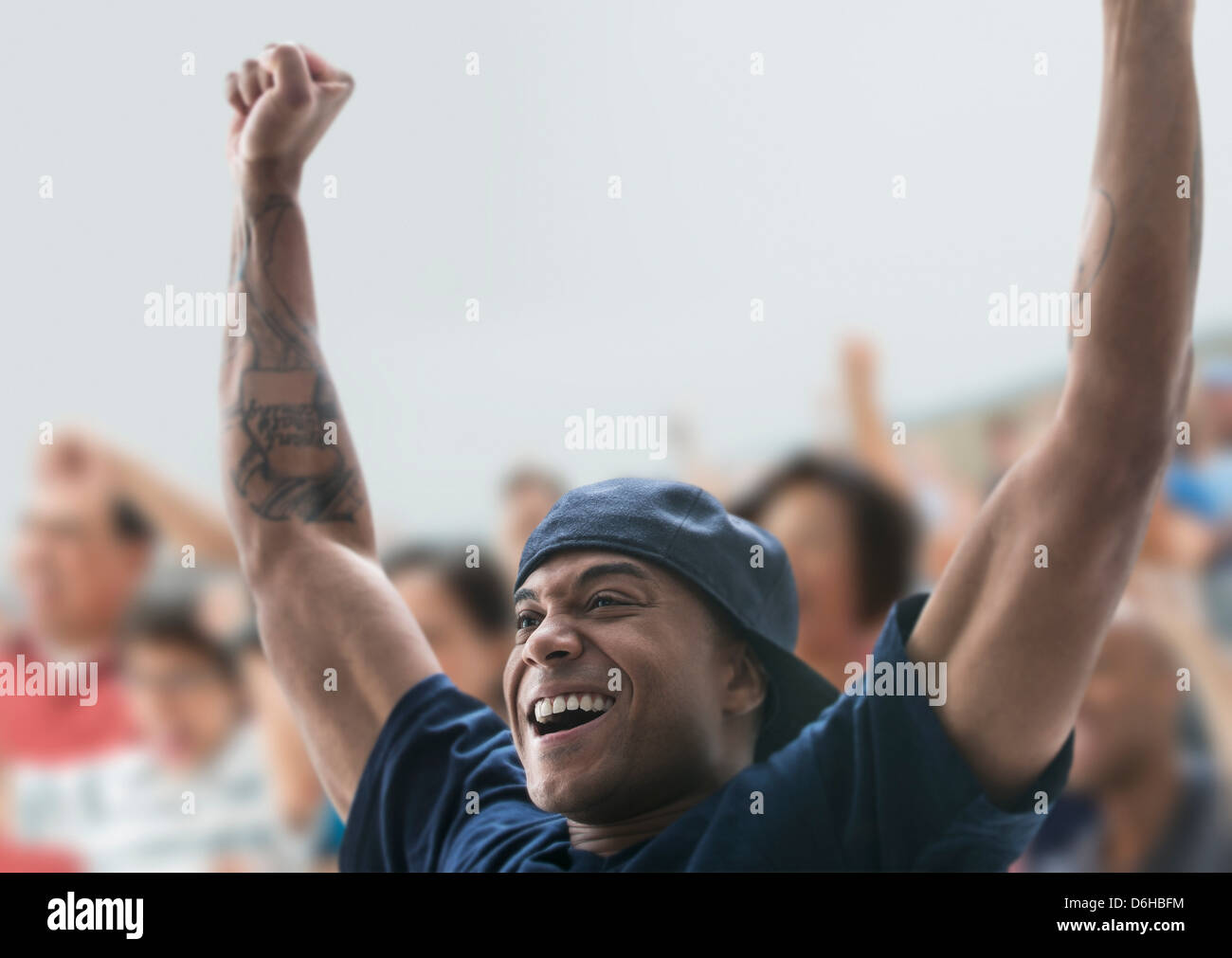 Sports Cheering Arms Back Stock Photos & Sports Cheering Arms Back ...