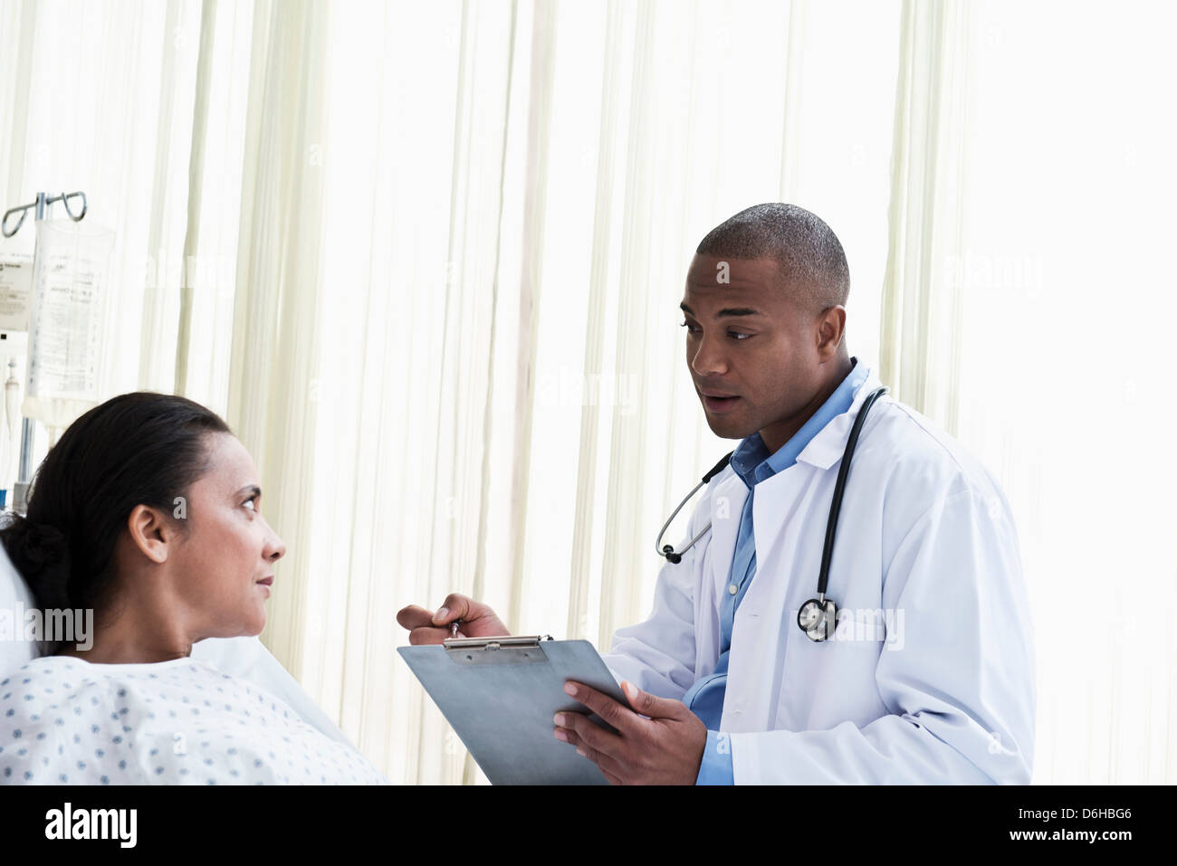 Doctor talking to patient in hospital Stock Photo - Alamy