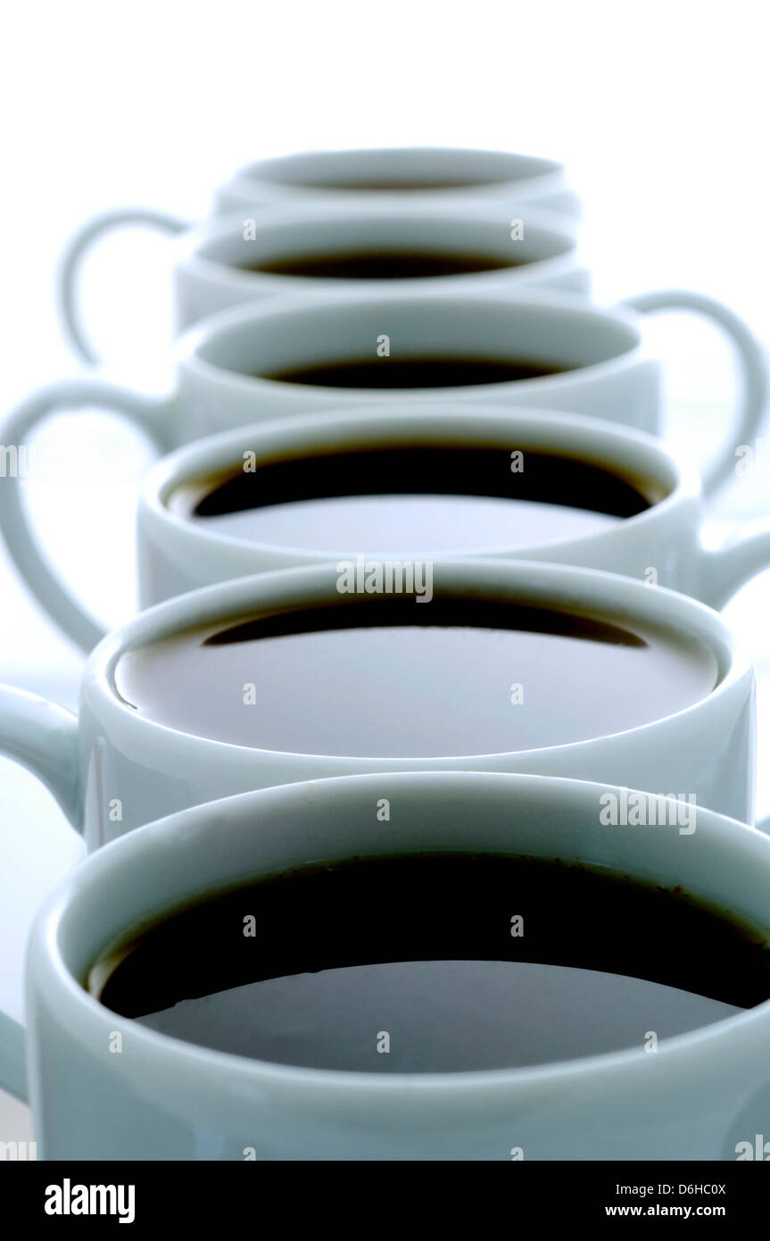 Cups of coffee in a line Stock Photo - Alamy