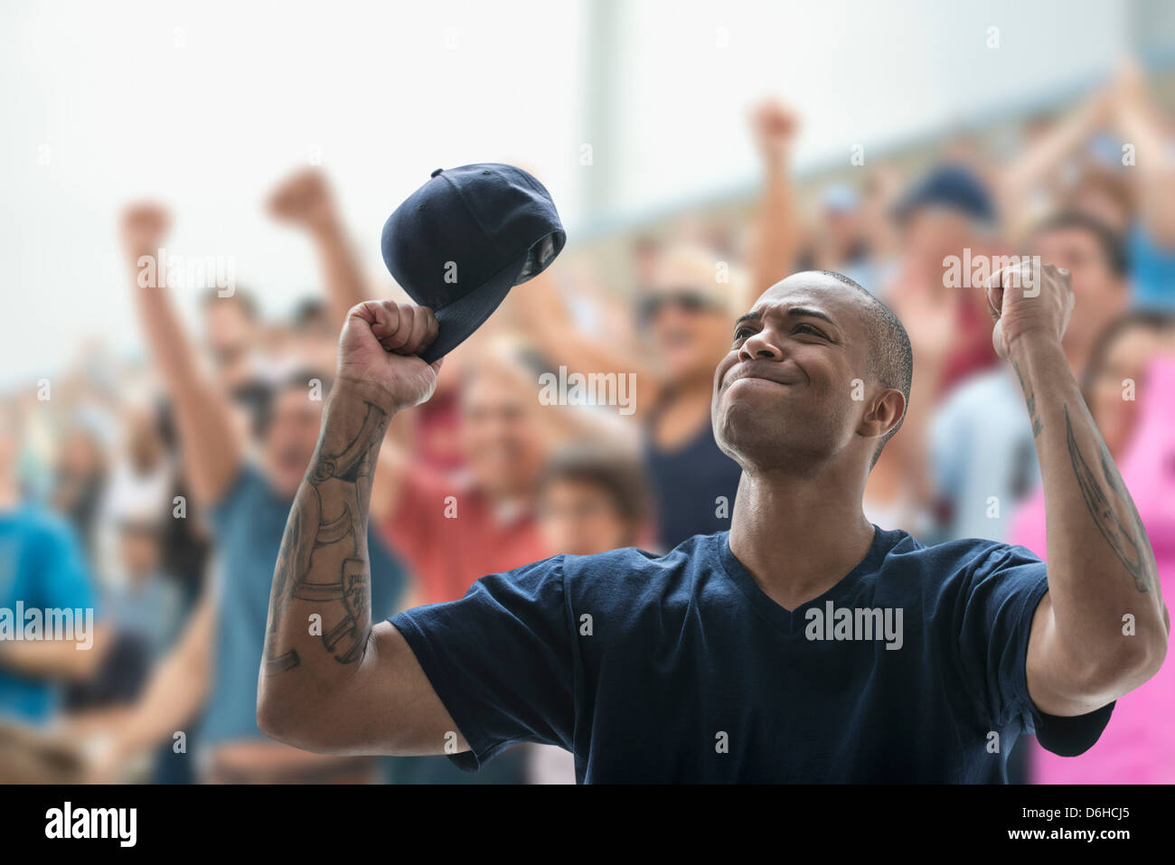 Man sports game, holding baseball cap and looking frustrated Stock ...