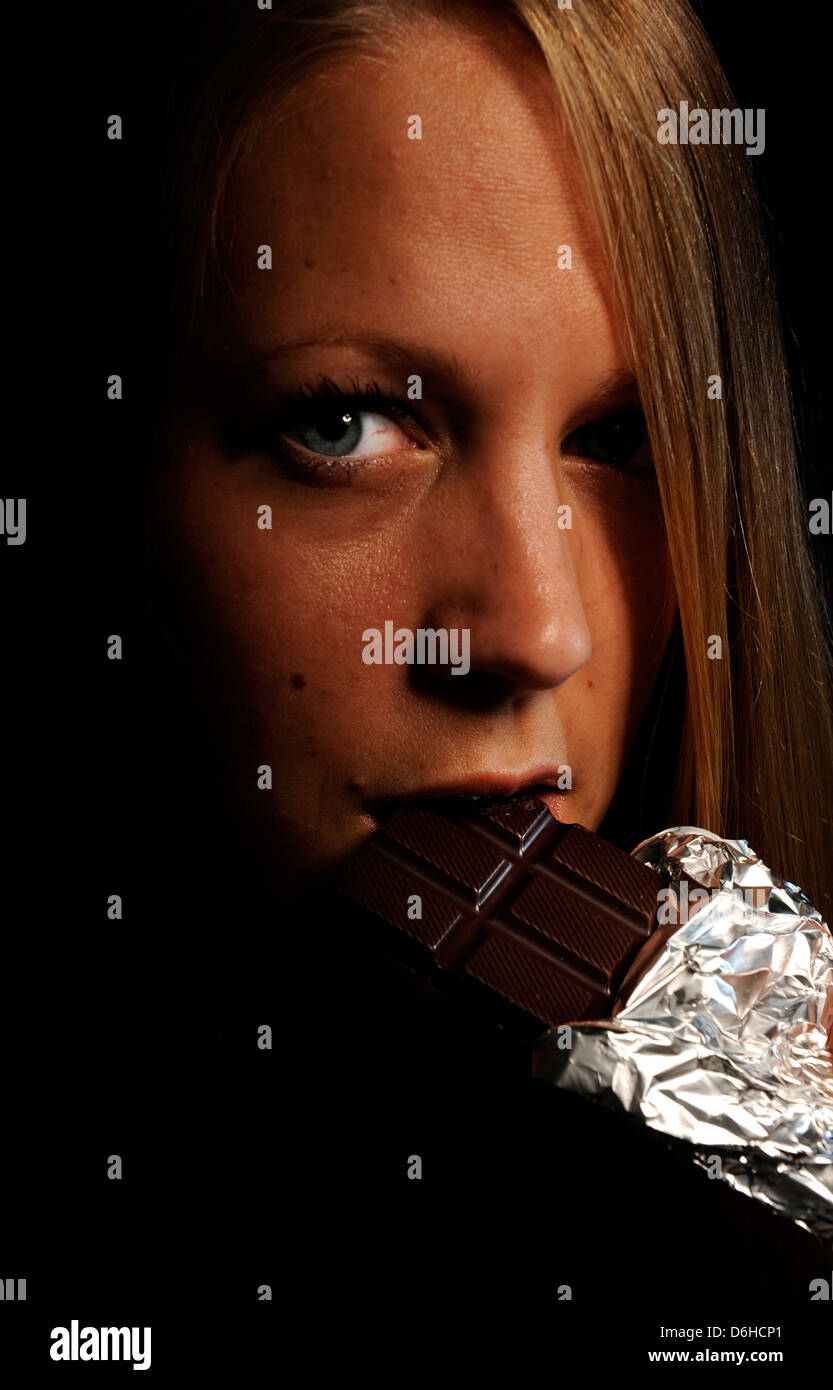 Black person eating snack bar hi-res stock photography and images - Alamy