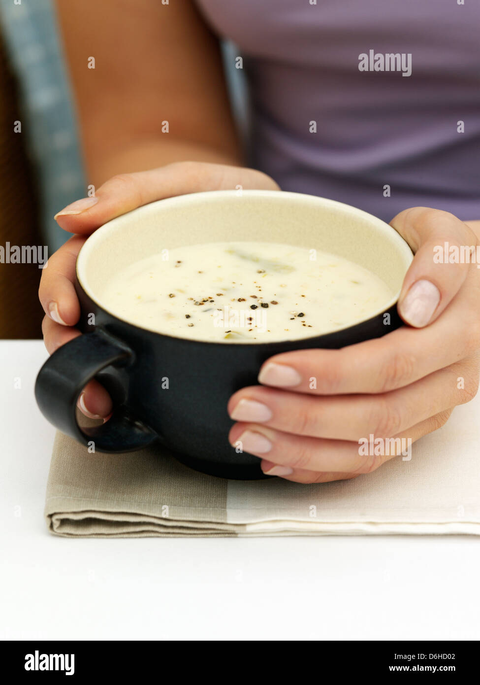 Soup, bowl and cupped hands Stock Photo - Alamy