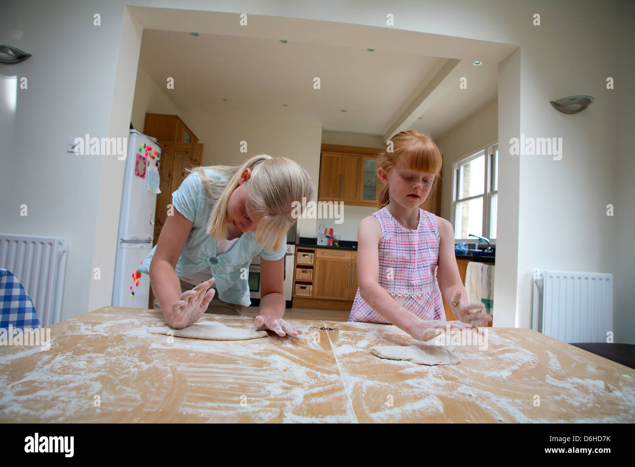 Young girls making pastry Stock Photo - Alamy
