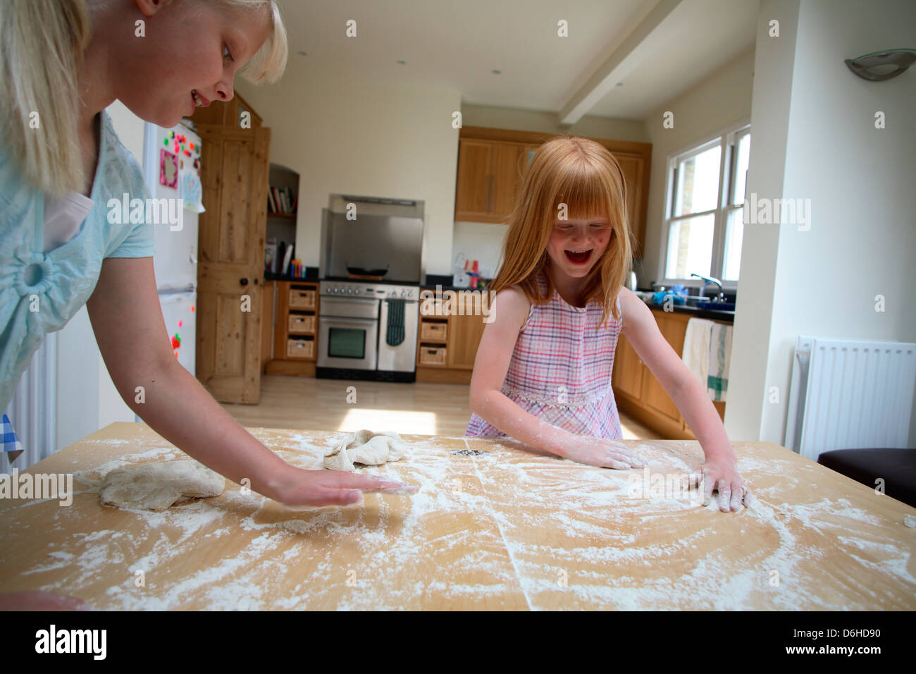 Young girls making pastry Stock Photo - Alamy