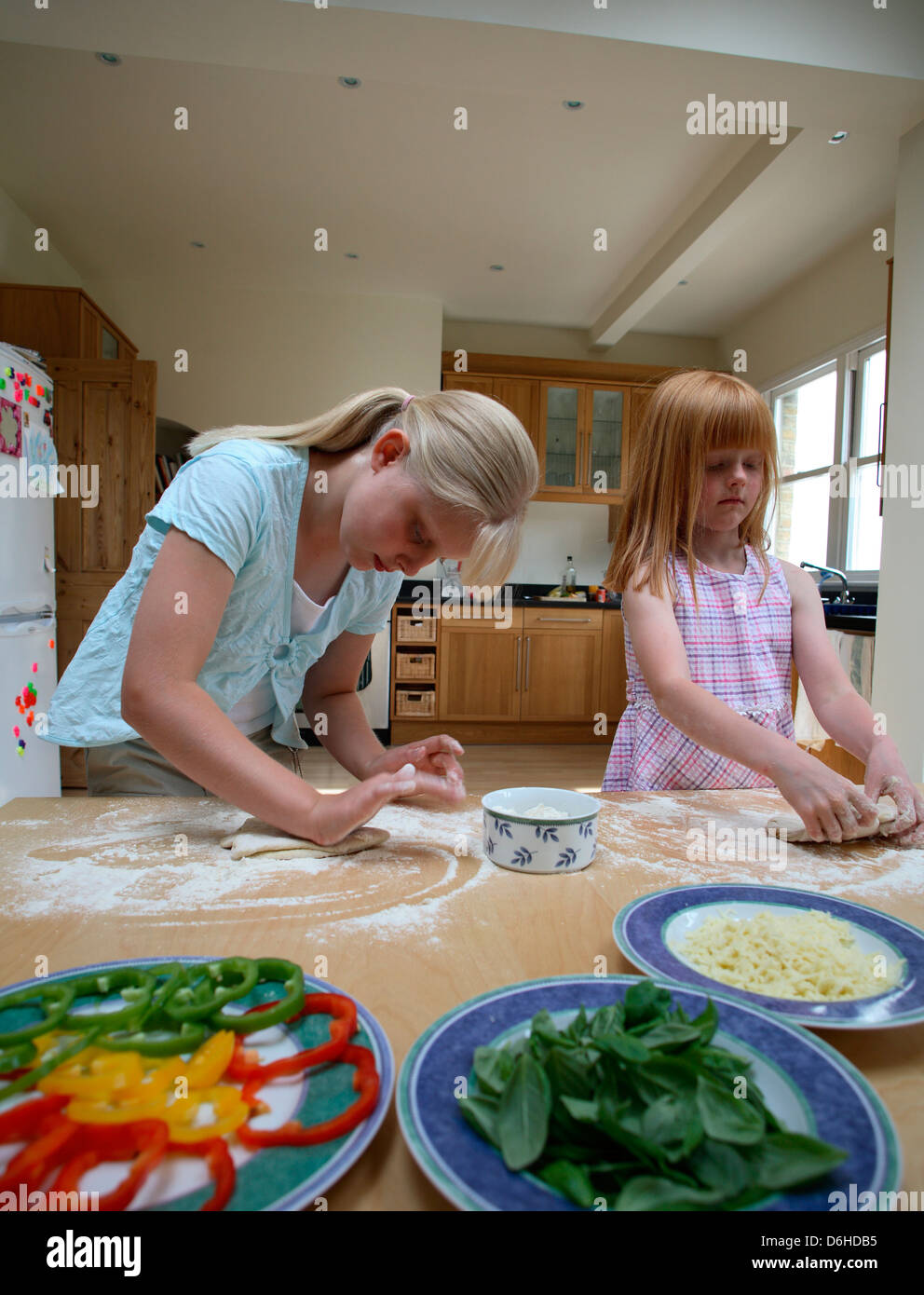 Young girls making pastry Stock Photo - Alamy