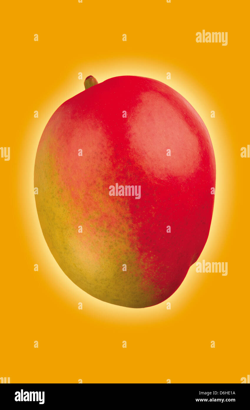Mango on orange background Stock Photo - Alamy