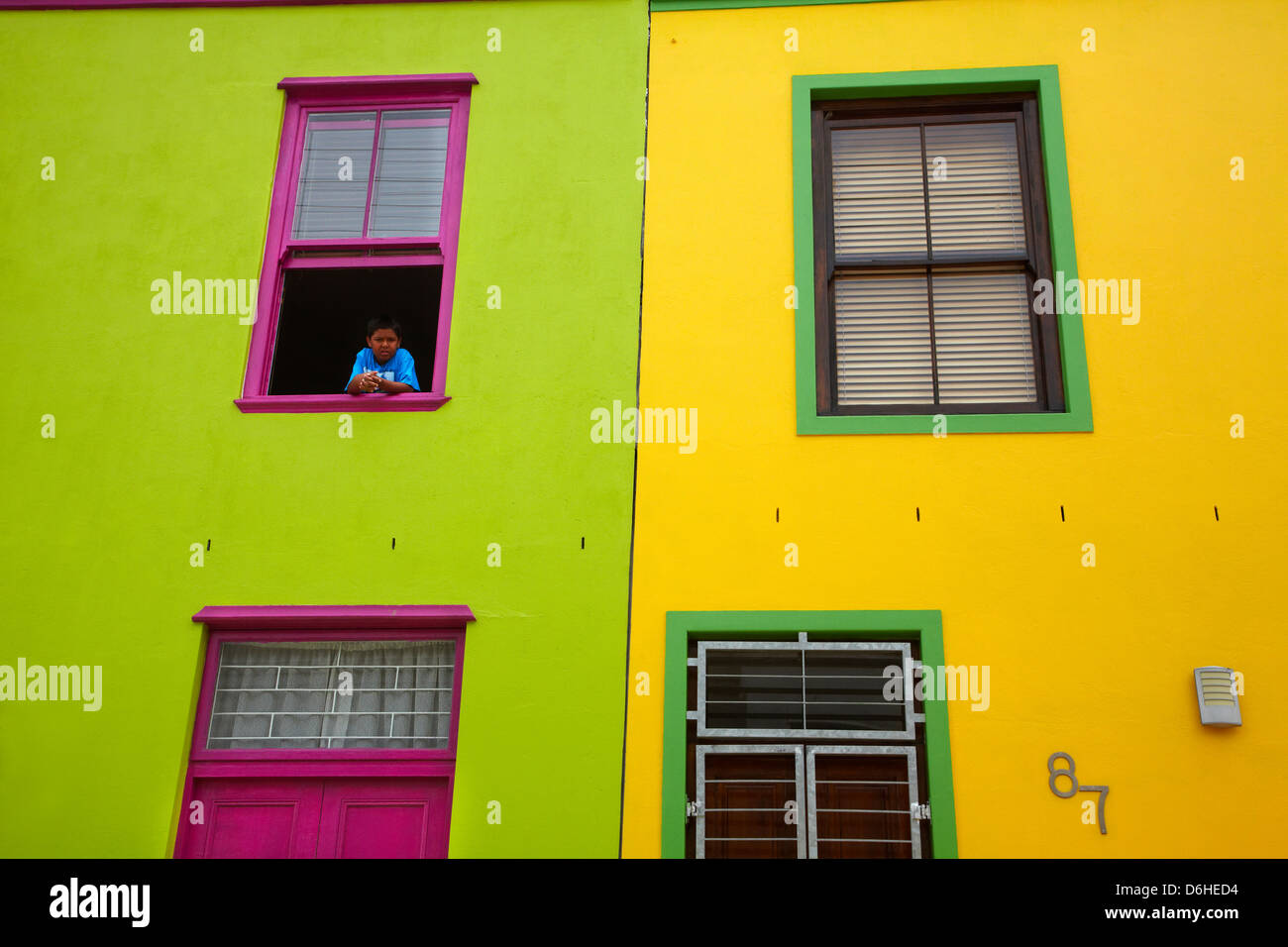 Boy looking out window of colourful house, Bo-Kaap, Cape Town, South ...