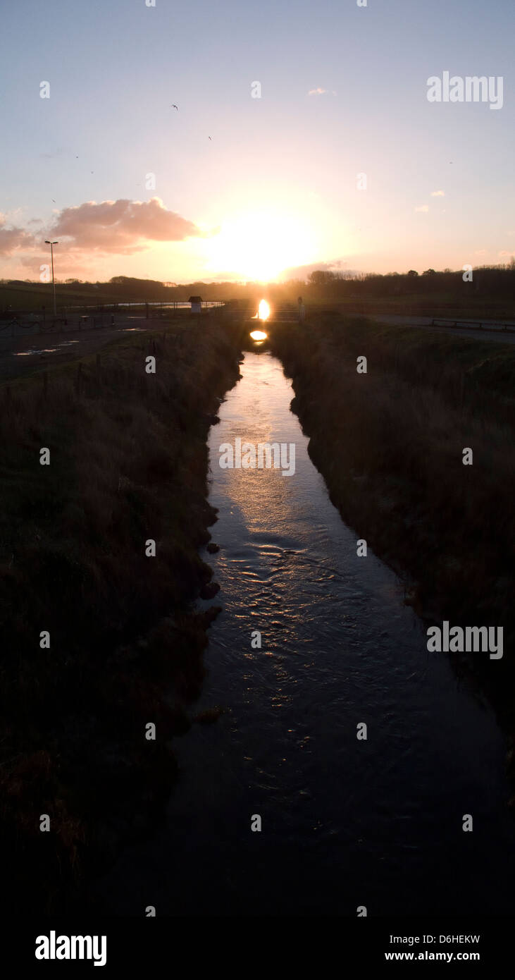 Sunrise over stream, Normandy, France Stock Photo - Alamy